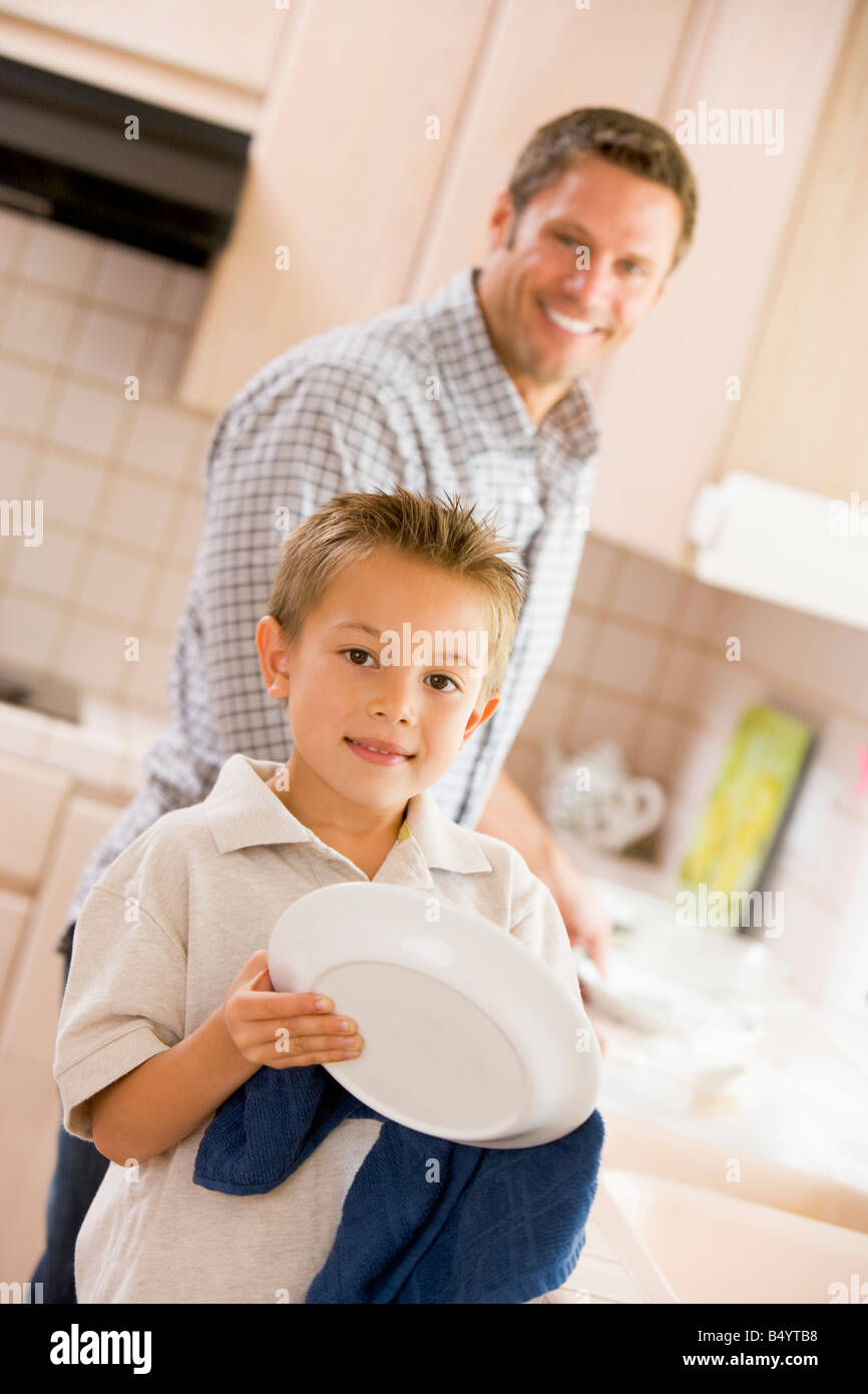 Father and son washing dishes hi-res stock photography and images - Alamy