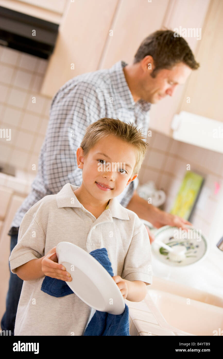 Father And Son Cleaning Dishes Stock Photo - Alamy