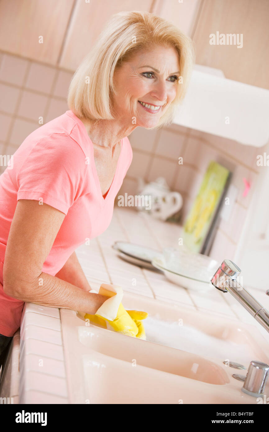 Woman Cleaning Kitchen Counter Stock Photo - Alamy