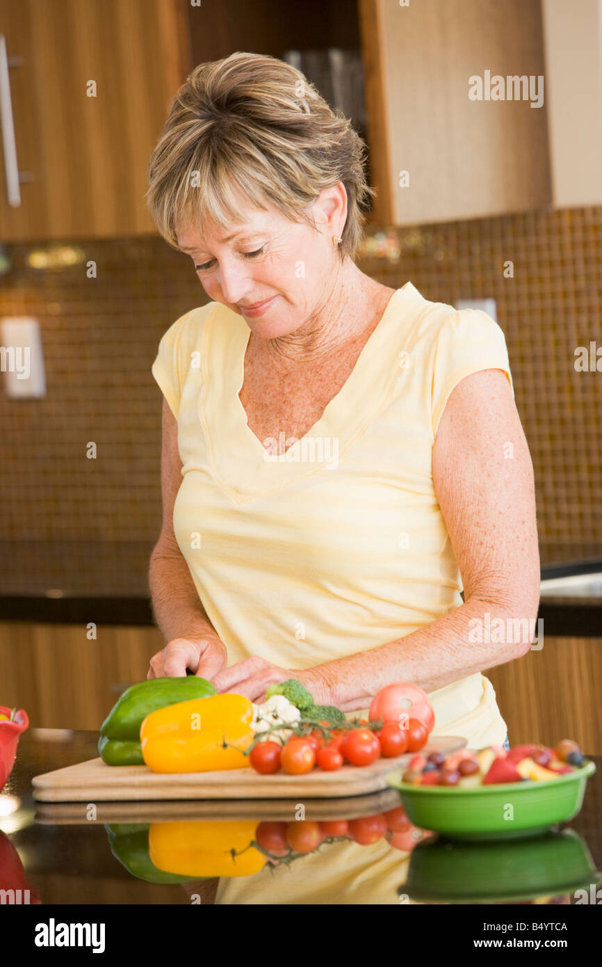 Woman Cutting Up Vegetables Stock Photo - Alamy