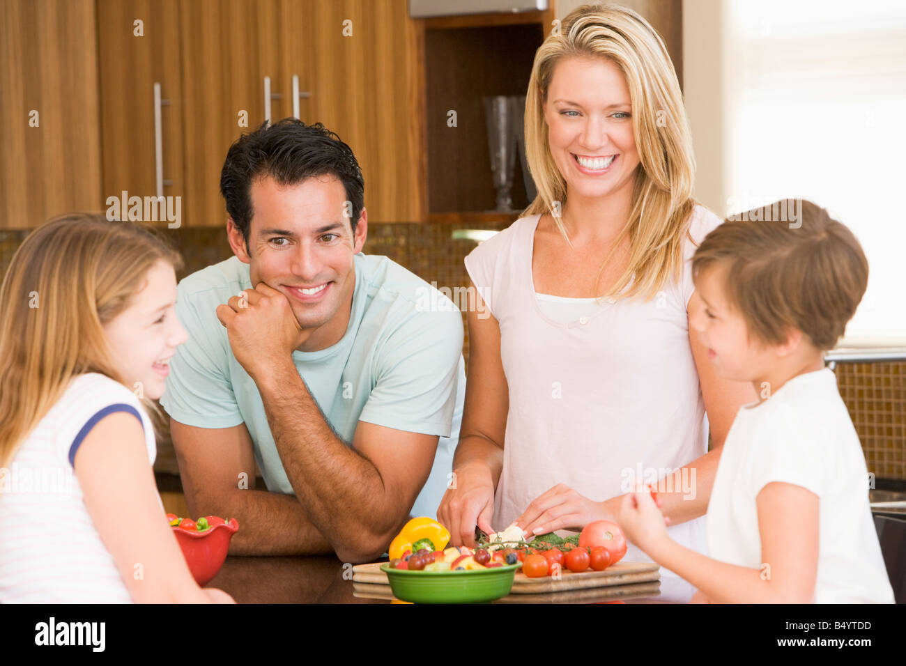 Family Preparing Meal Together Stock Photo - Alamy