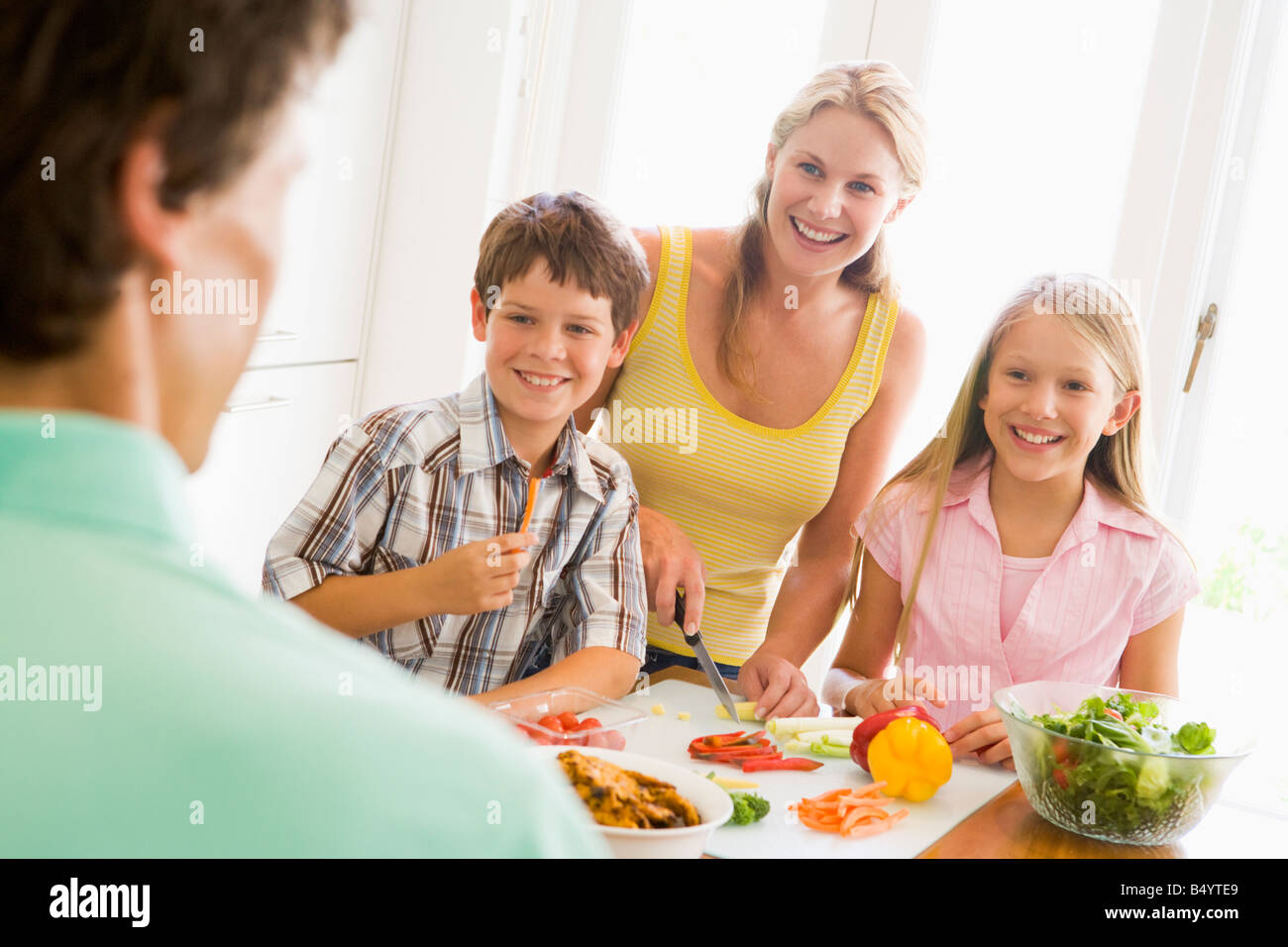 Family Preparing Meal Together Stock Photo - Alamy