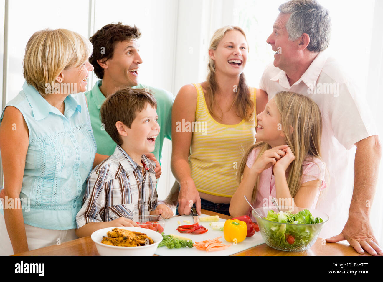 Family Preparing Meal Together Stock Photo - Alamy
