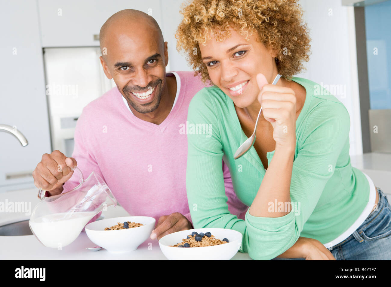 Middle aged african american couple eating food hi-res stock ...