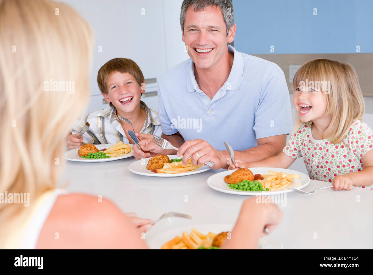 Family Eating A Meal Together Stock Photo - Alamy