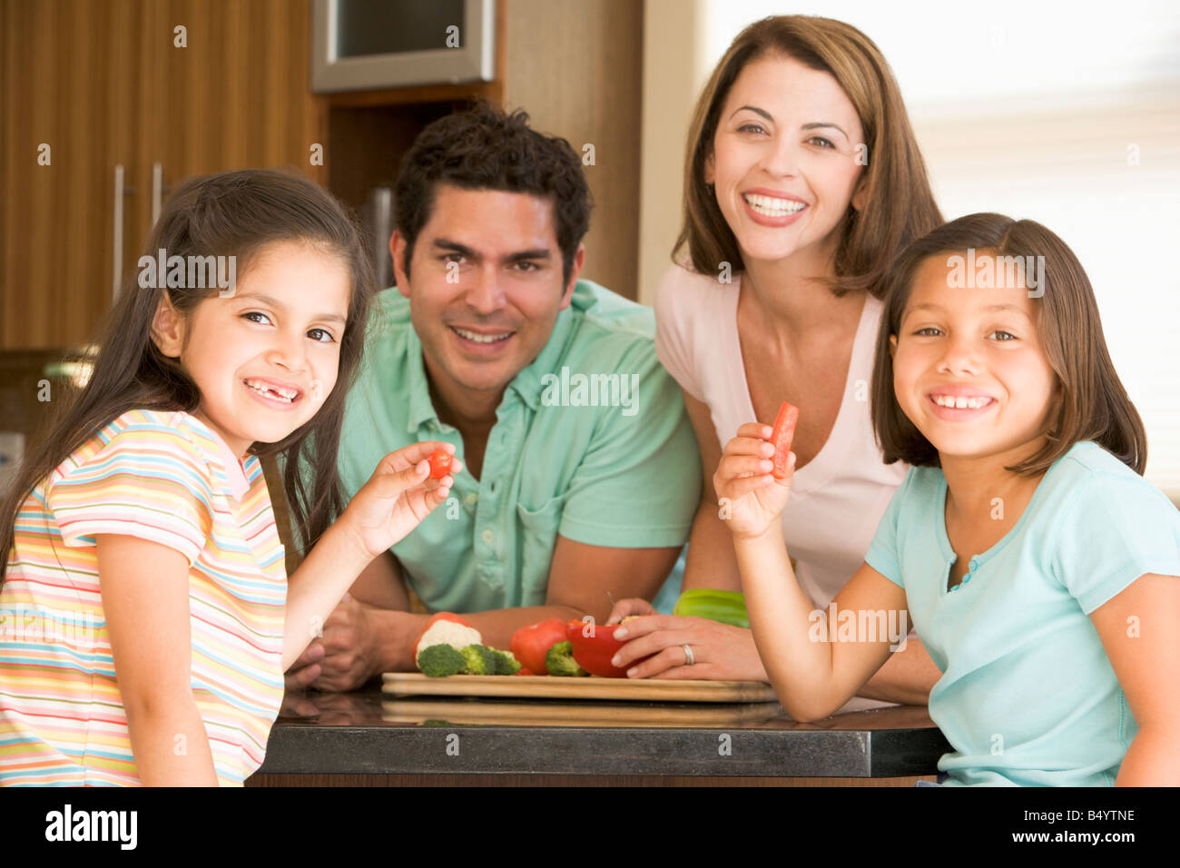 Family Preparing Meal Together Stock Photo - Alamy