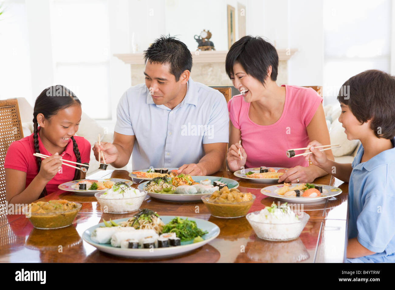 Family Enjoying Meal Together Stock Photo - Alamy