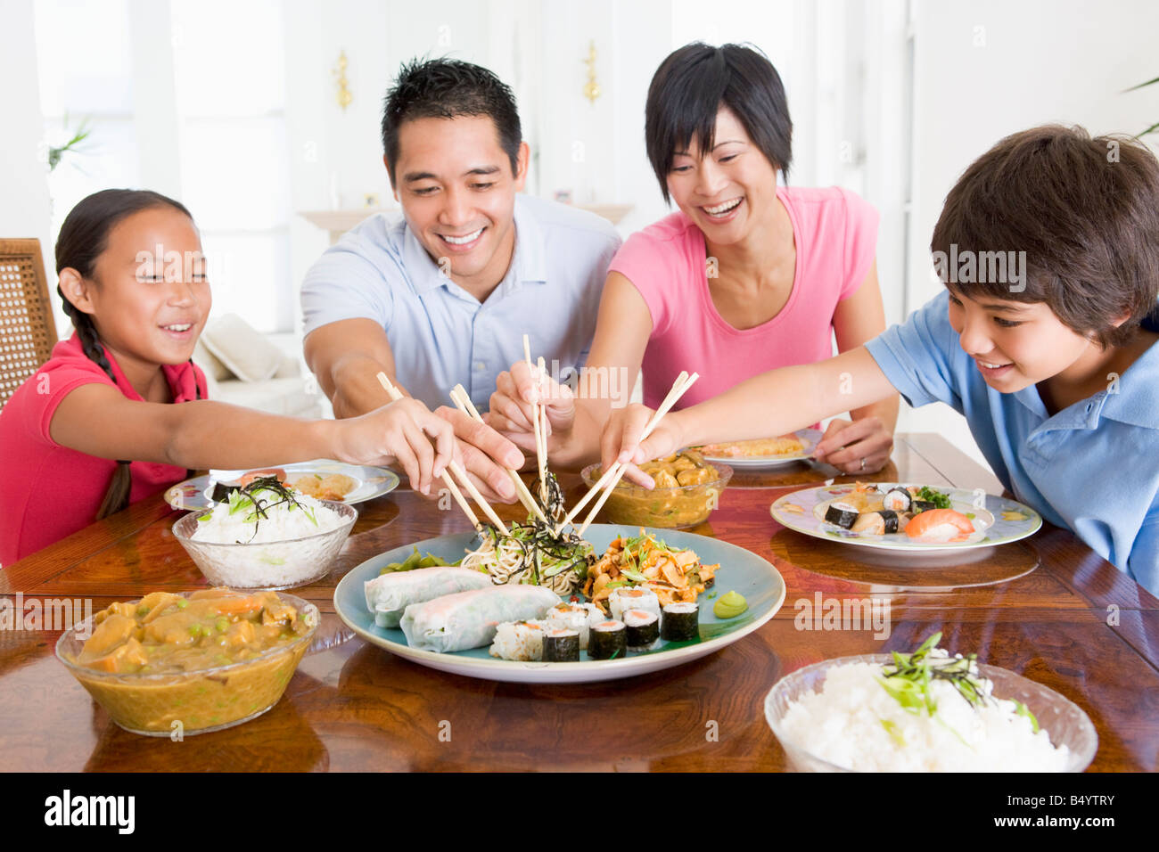 Family Enjoying Meal Together Stock Photo - Alamy