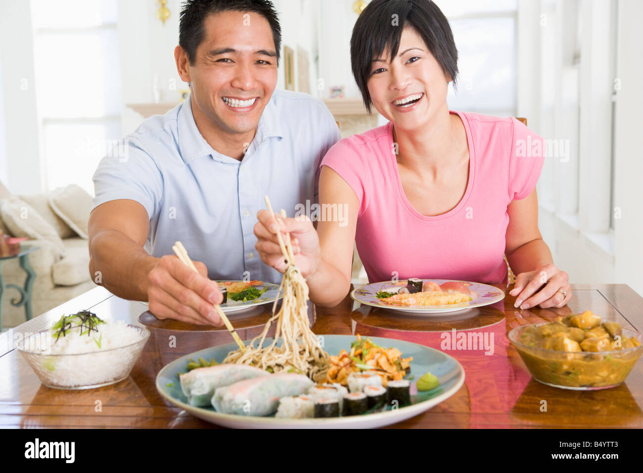Young Couple Enjoying Chinese Food Stock Photo - Alamy