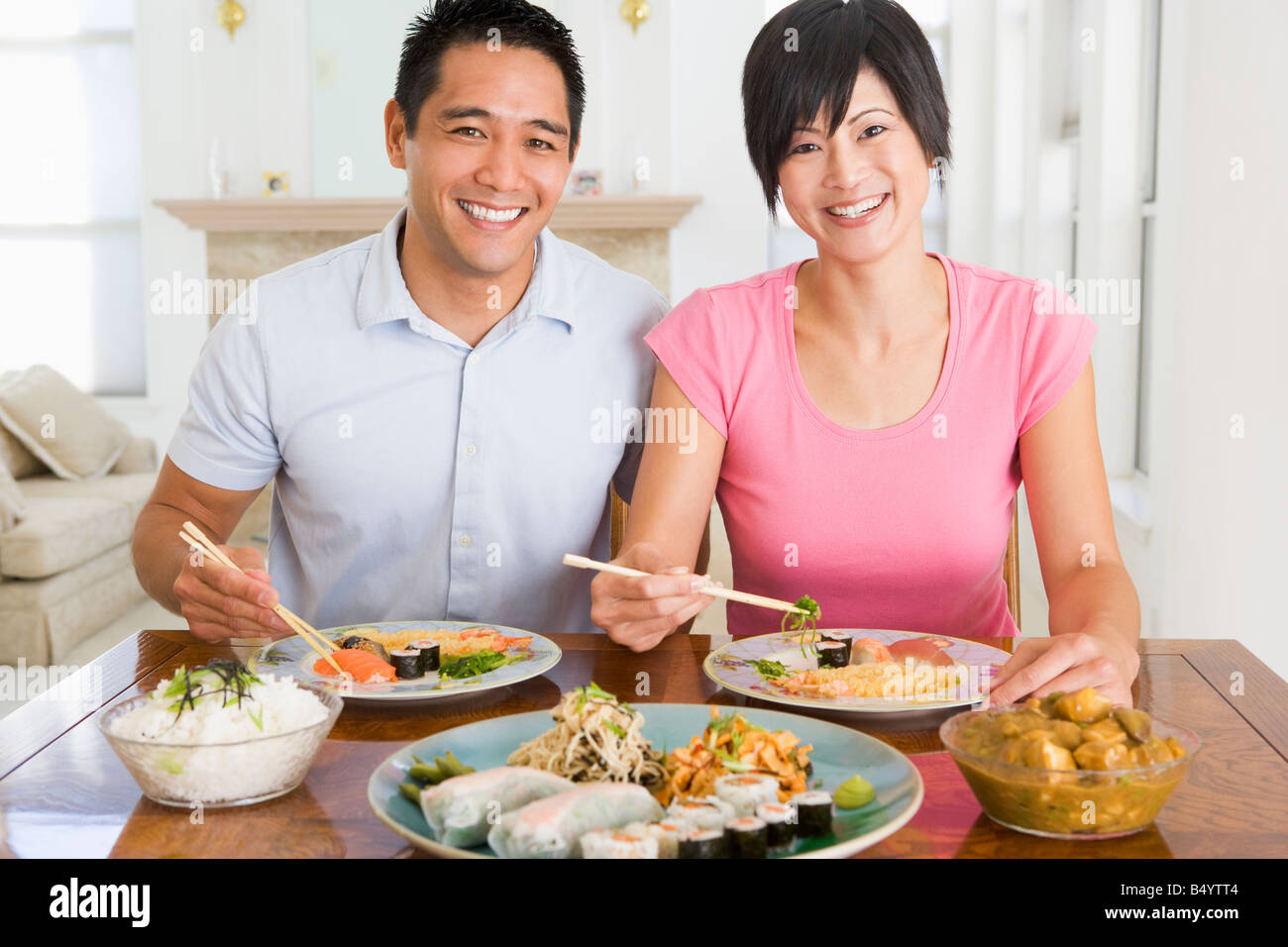 Young Couple Enjoying Chinese Food Stock Photo - Alamy