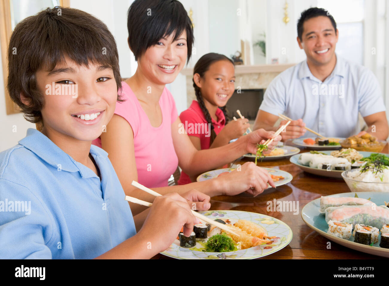 Family Eating A Meal Together Stock Photo - Alamy