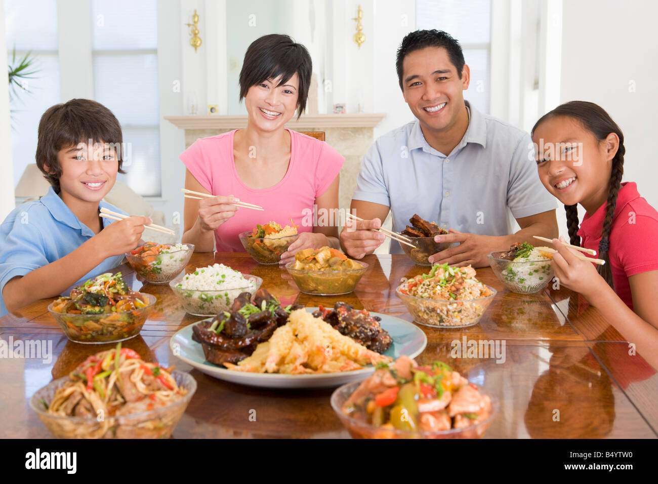 Family Enjoying Meal Together Stock Photo - Alamy