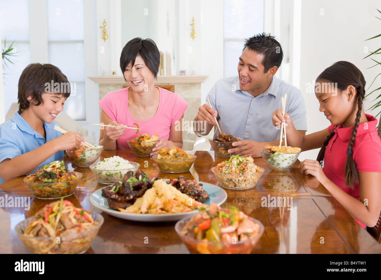 Family Enjoying Meal Together Stock Photo - Alamy