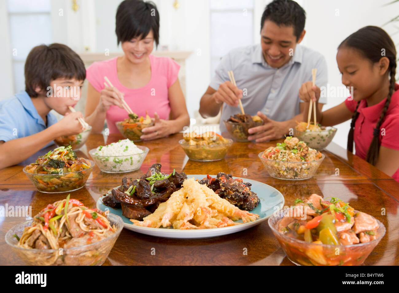 Family Enjoying Meal Together Stock Photo - Alamy