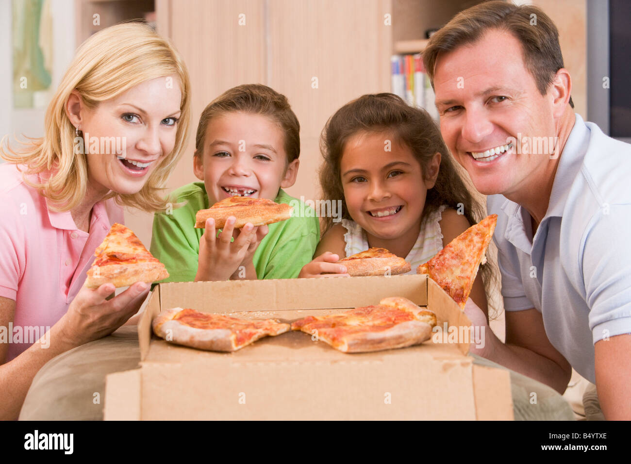 Family Eating Pizza Together Stock Photo - Alamy
