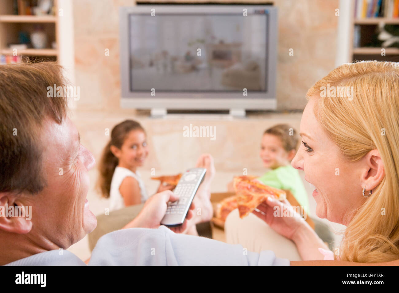 Girl eating in front of television hi-res stock photography and images ...