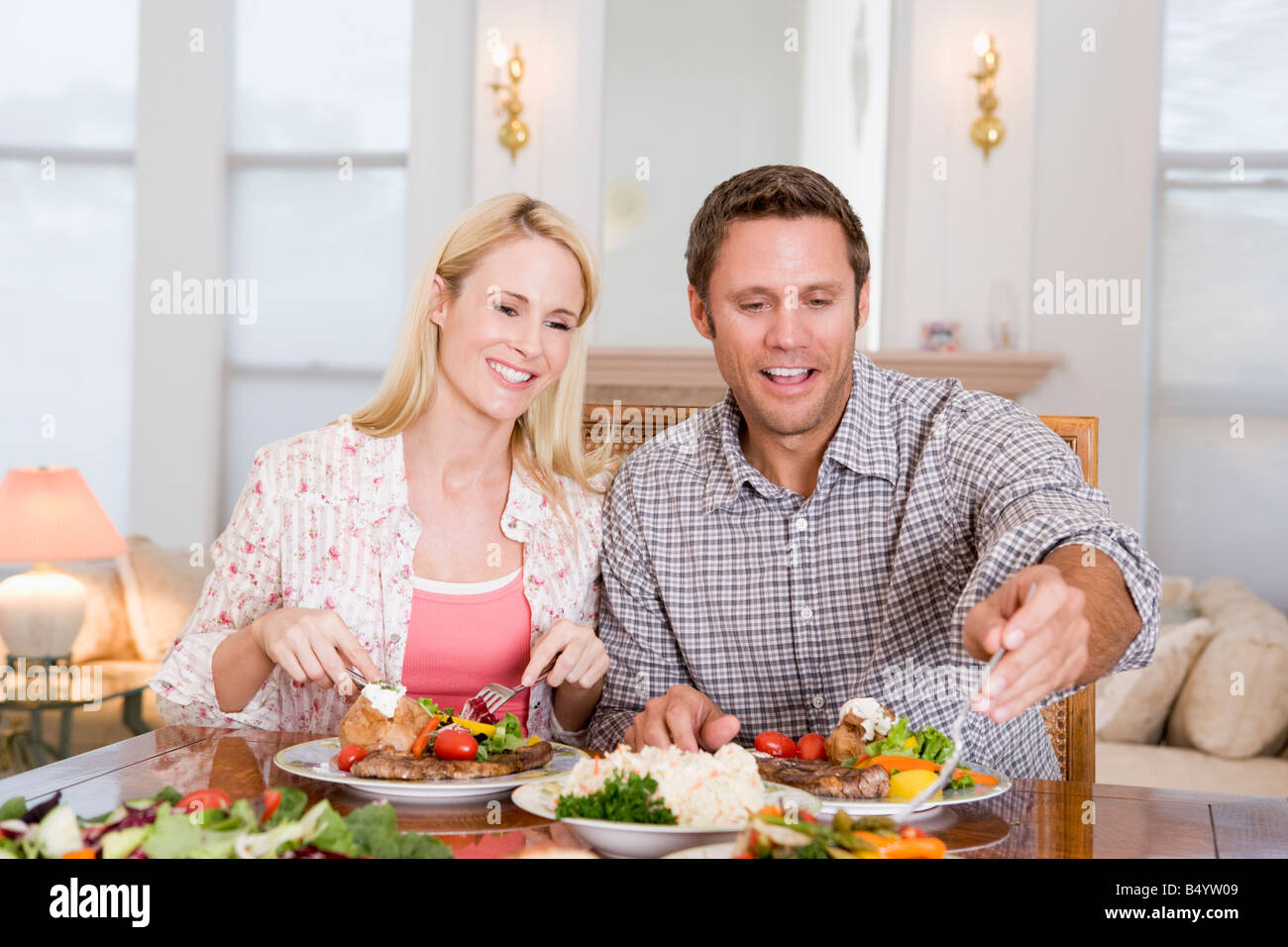 Couple Eating Meal Together Stock Photo - Alamy