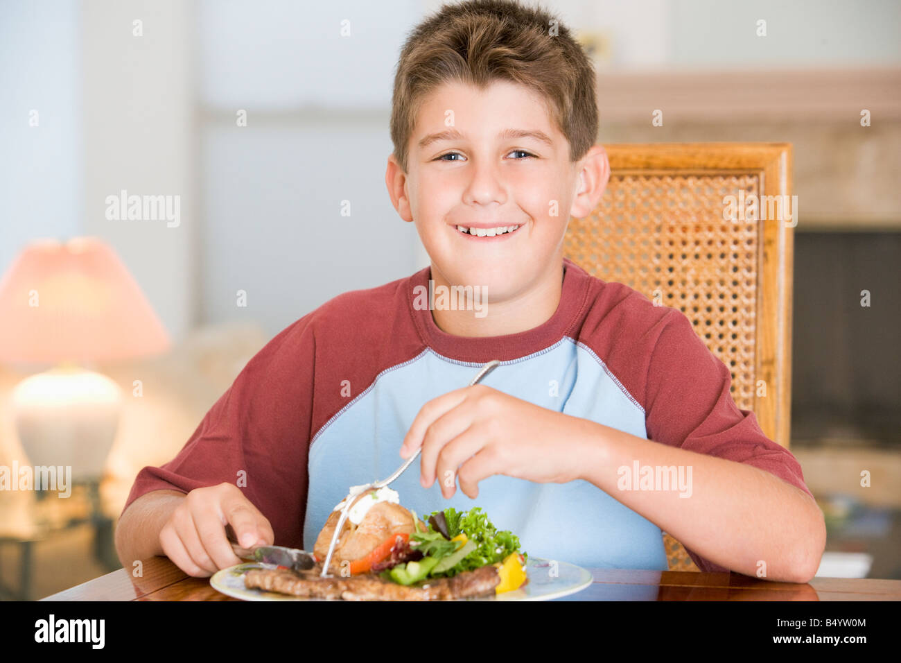 Young Boy Eating Meal Stock Photo - Alamy