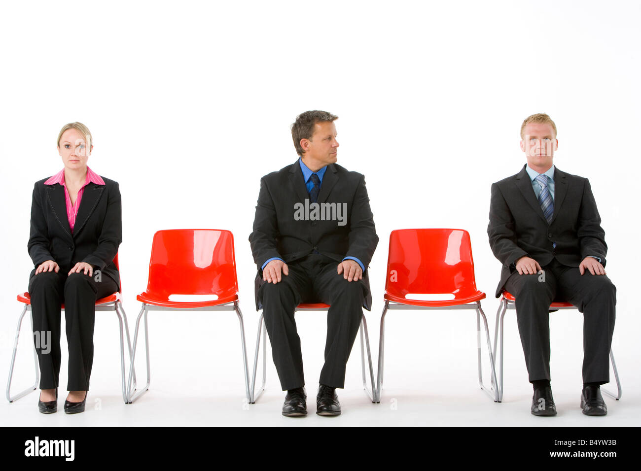 Three Business People Sitting On Red Plastic Seats Stock Photo - Alamy