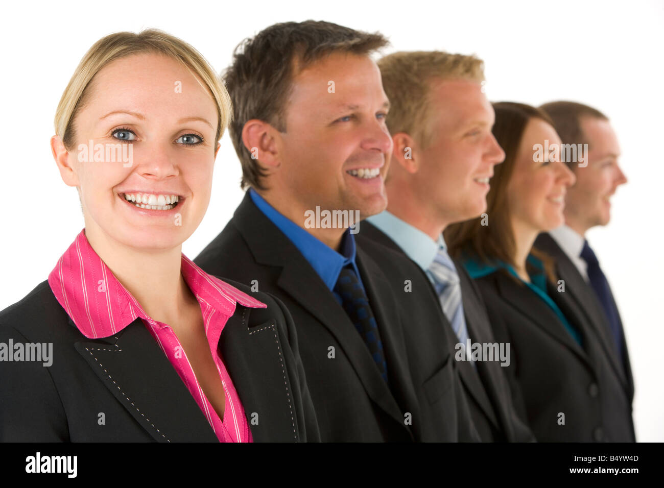 Group Of Business People In A Line Smiling Stock Photo - Alamy