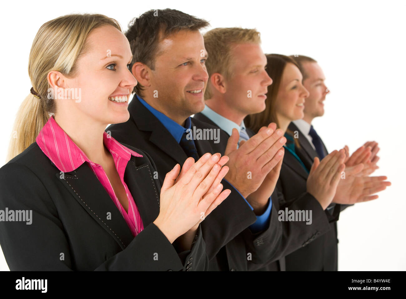 Group Of Business People In A Line Smiling And Applauding Stock Photo ...