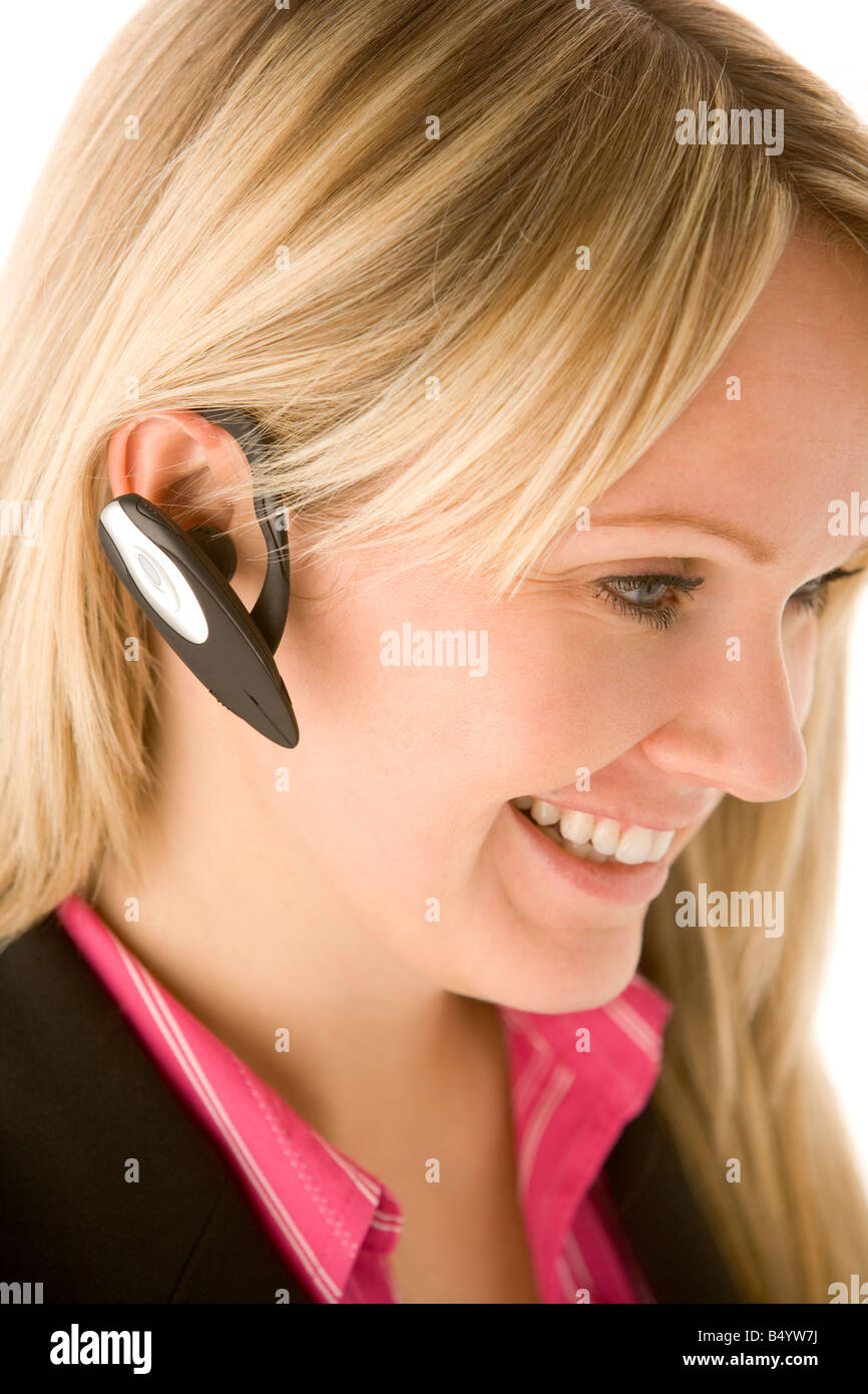 Businesswoman Talking On Hands Free Phone Stock Photo - Alamy