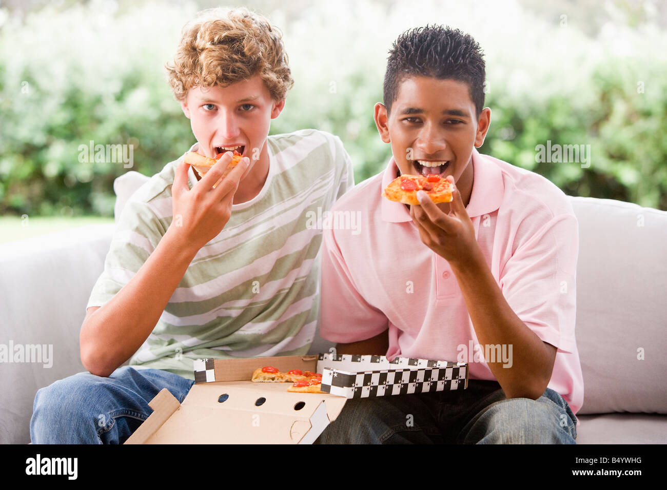 Boys eating fast food teenagers hi-res stock photography and images - Alamy