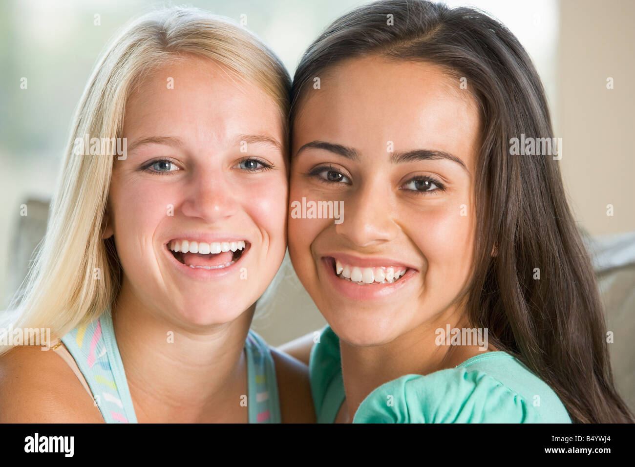 Two Teenage Girls Smiling Stock Photo - Alamy