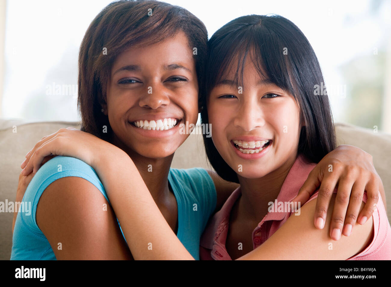 Two Teenage Girls Smiling Stock Photo - Alamy