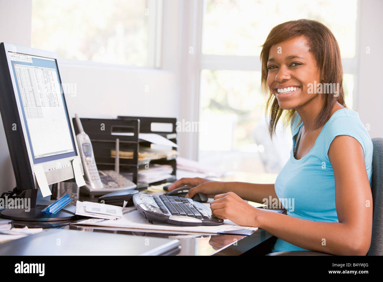 Teen girl using computer mouse hi-res stock photography and images - Alamy