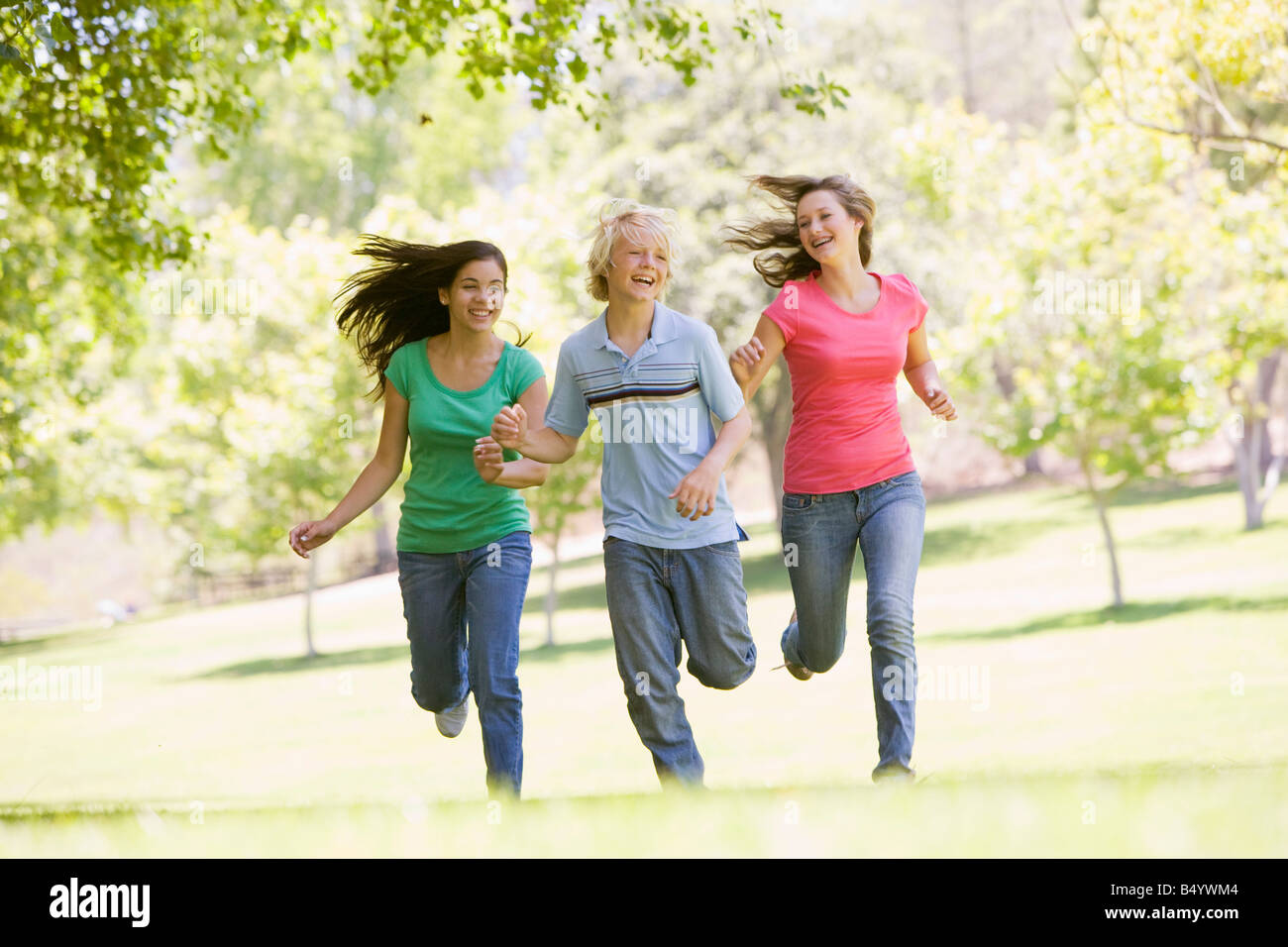 Happy teenagers running hi-res stock photography and images - Alamy