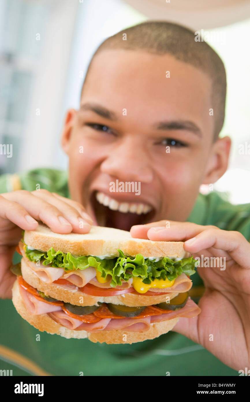 Teenage Boy Eating Sandwich Stock Photo - Alamy