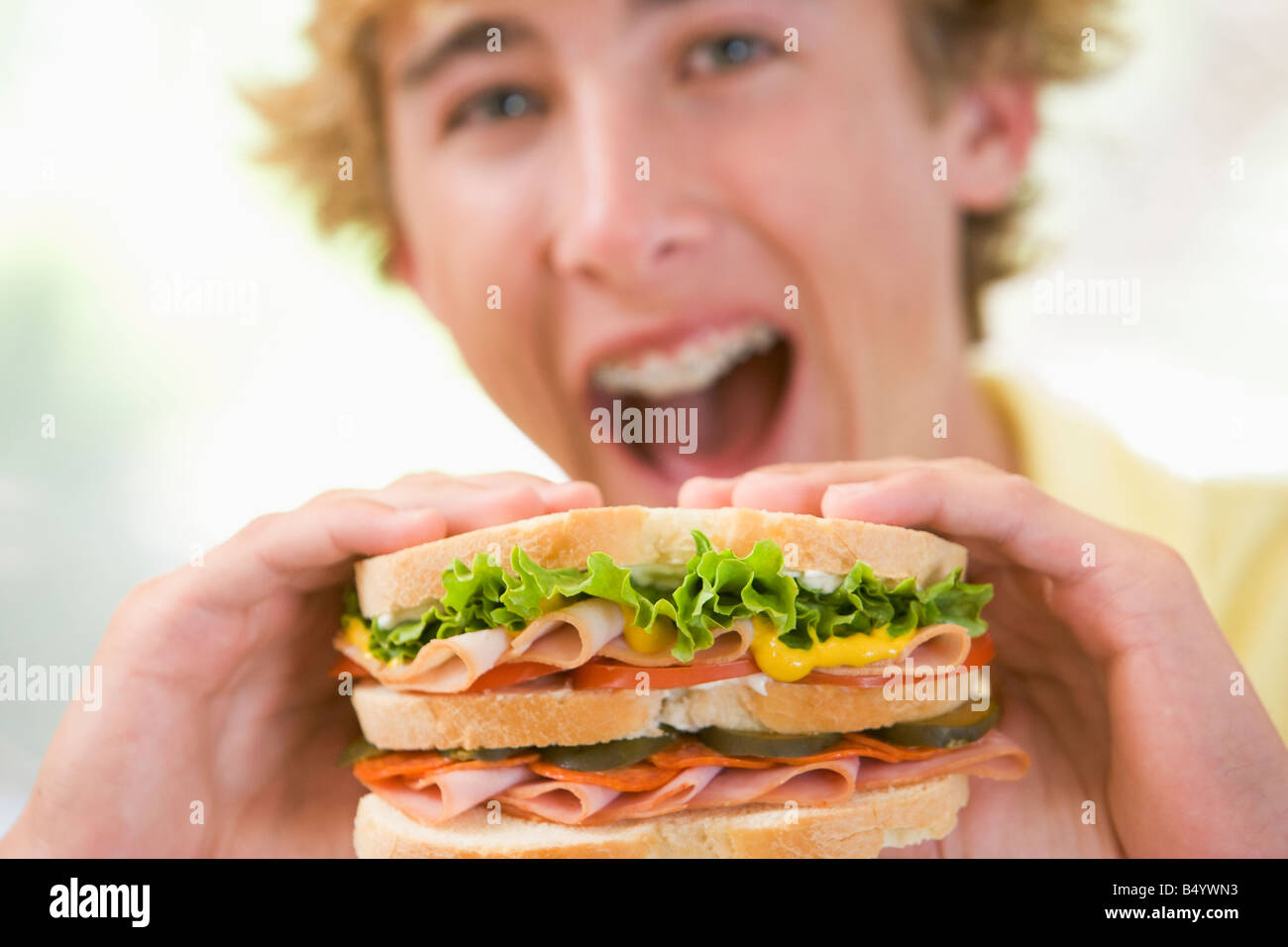 Year old boy eating sandwich hi-res stock photography and images - Alamy
