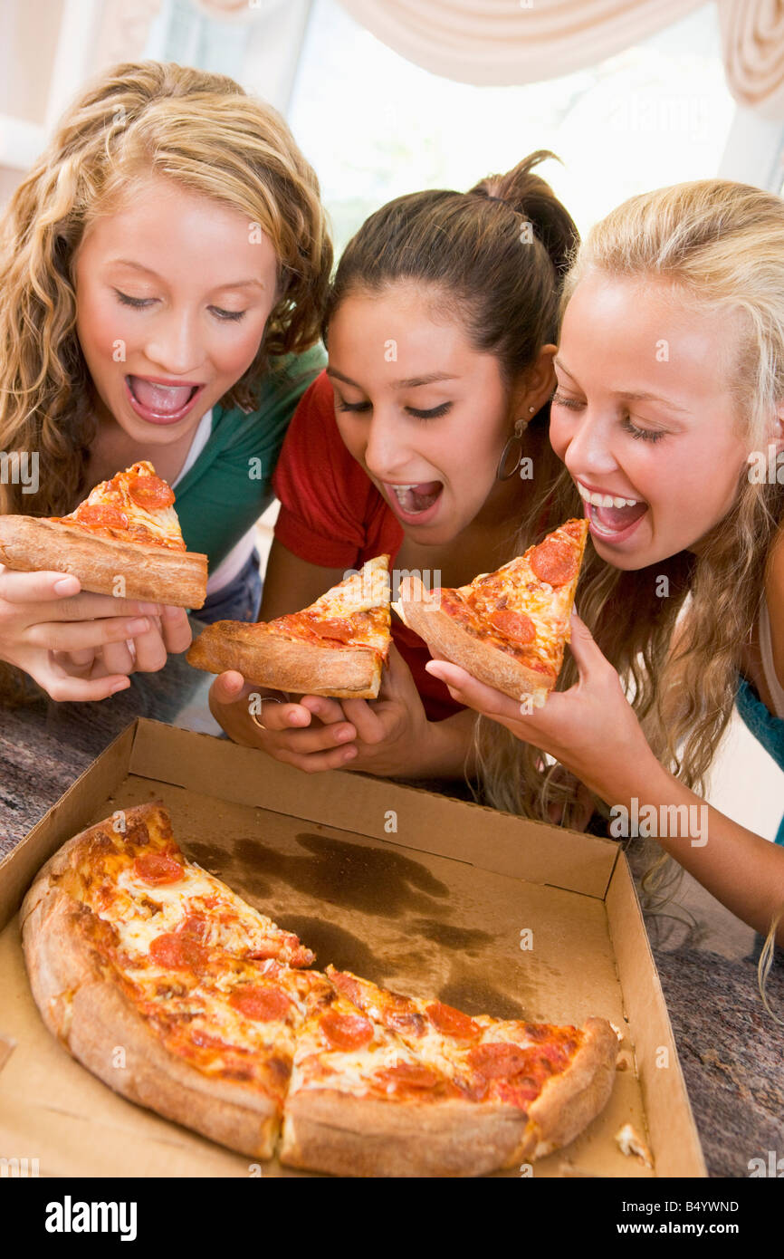 Teenage Girls Eating Pizza Stock Photo - Alamy