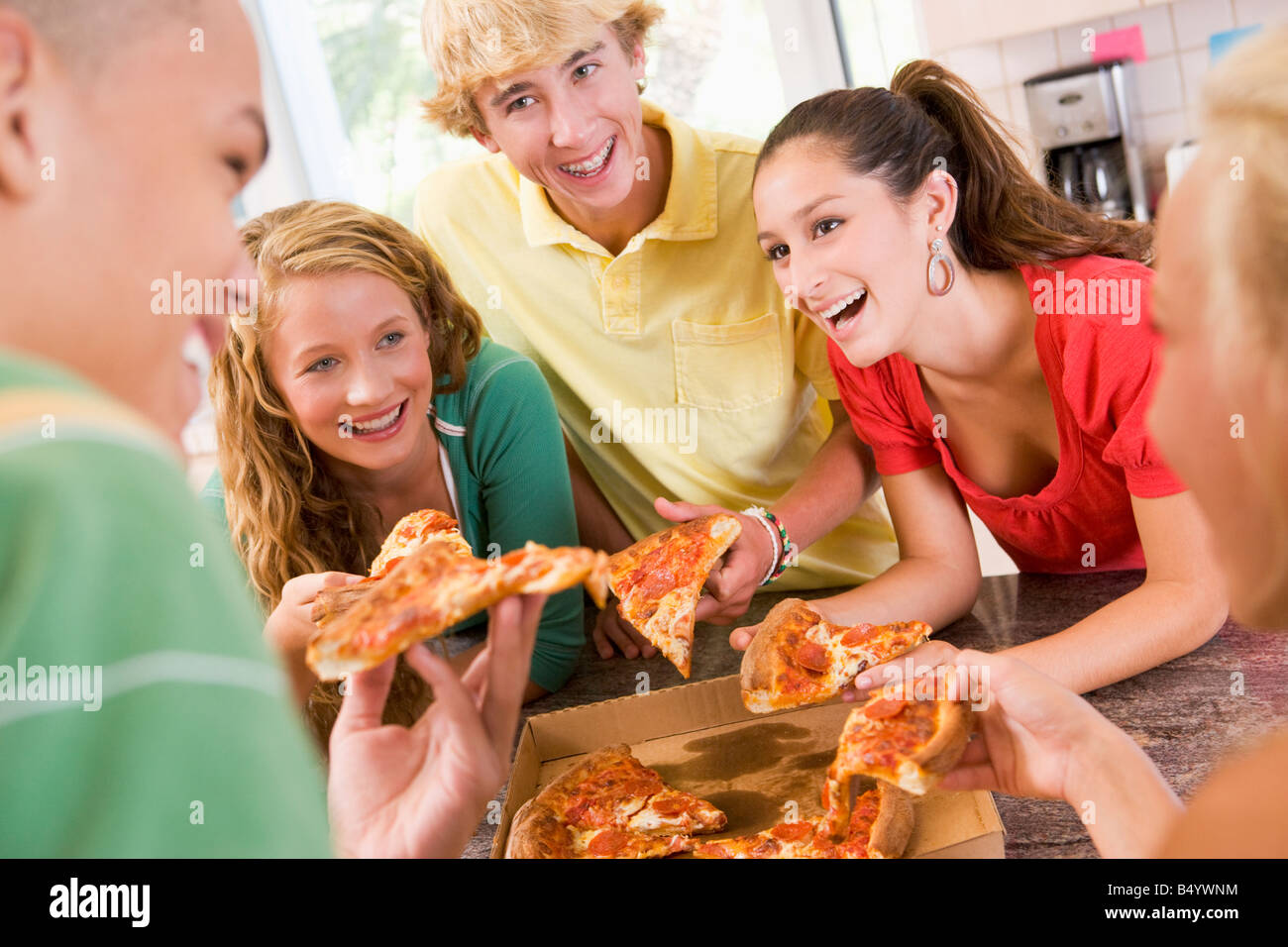 Group Of Teenagers Eating Pizza Stock Photo - Alamy