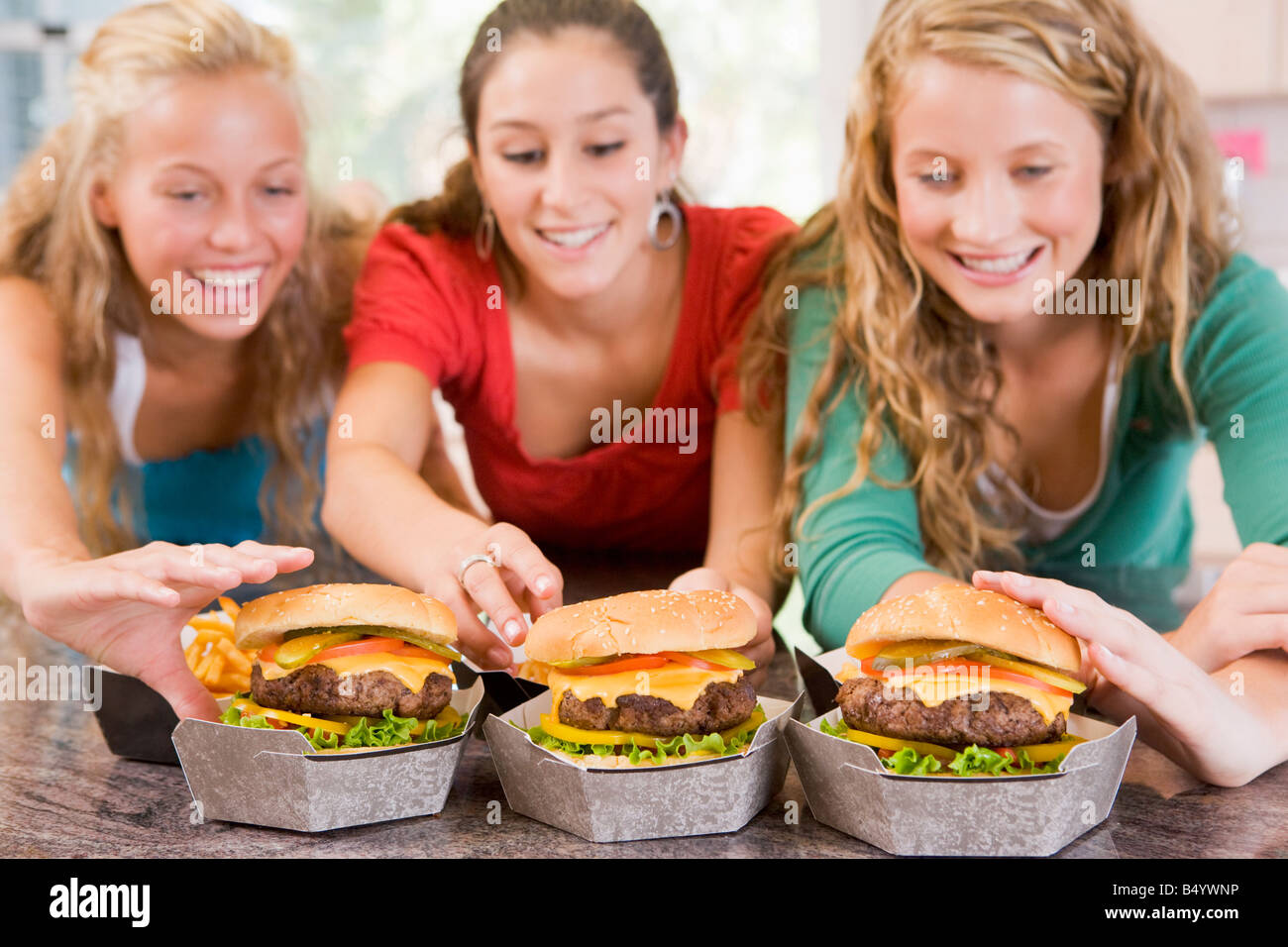 Teenage Girls Eating Burgers Stock Photo - Alamy