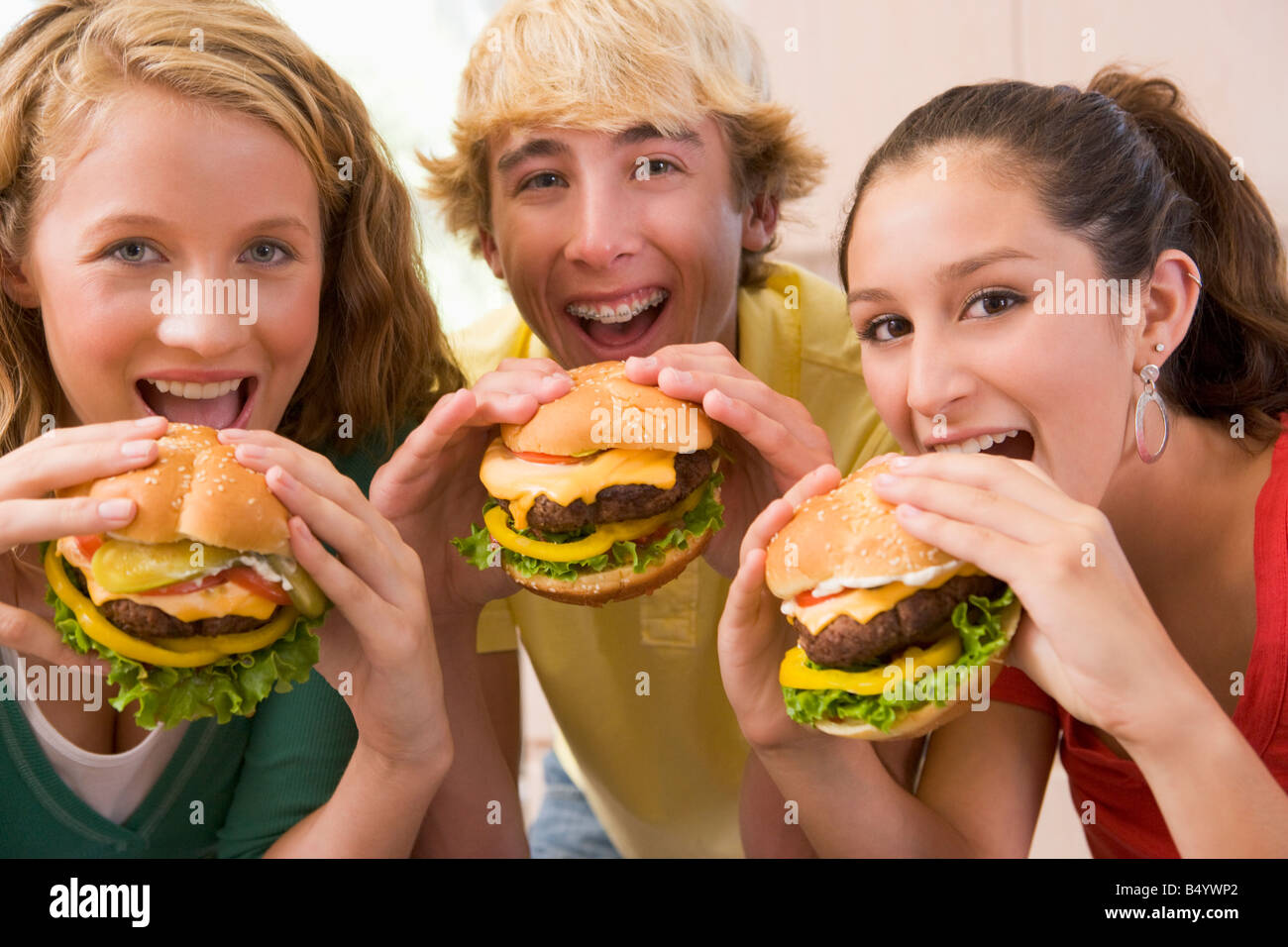 Teenagers Eating Burgers Stock Photo - Alamy