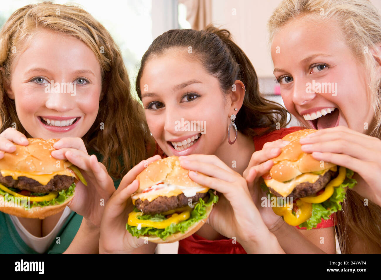 Teenage Girls Eating Burgers Stock Photo - Alamy