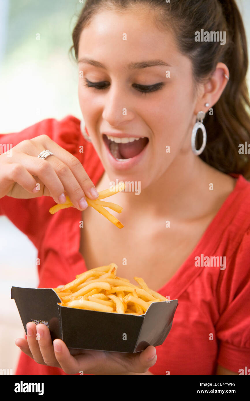 Teenage Girl Eating French Fries Stock Photo - Alamy