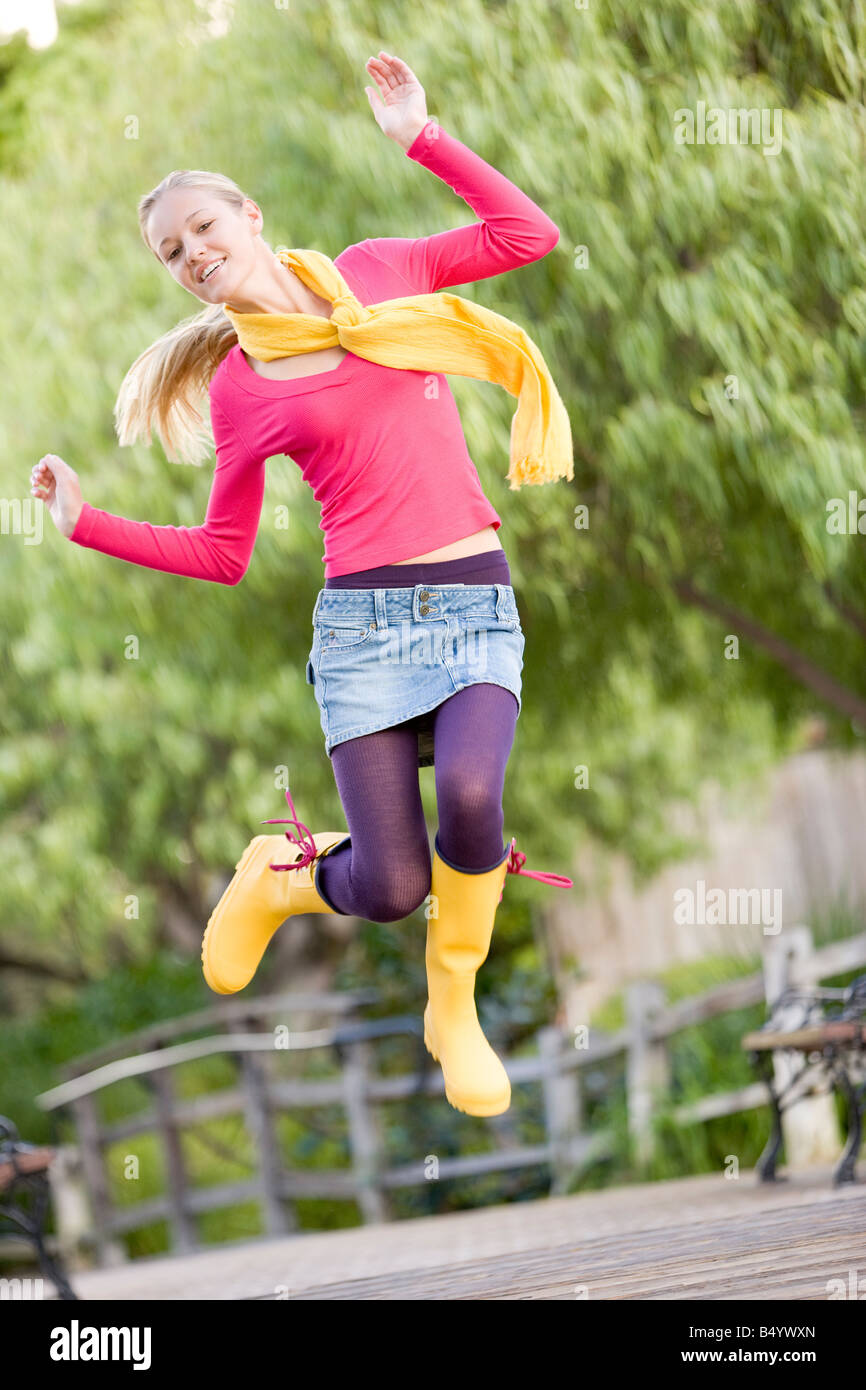 Teenage Girl Frolicking Outdoors Stock Photo - Alamy