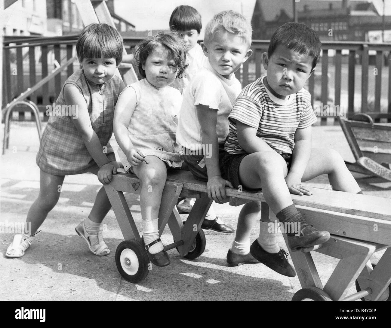 1960s children playing playground hi-res stock photography and images ...