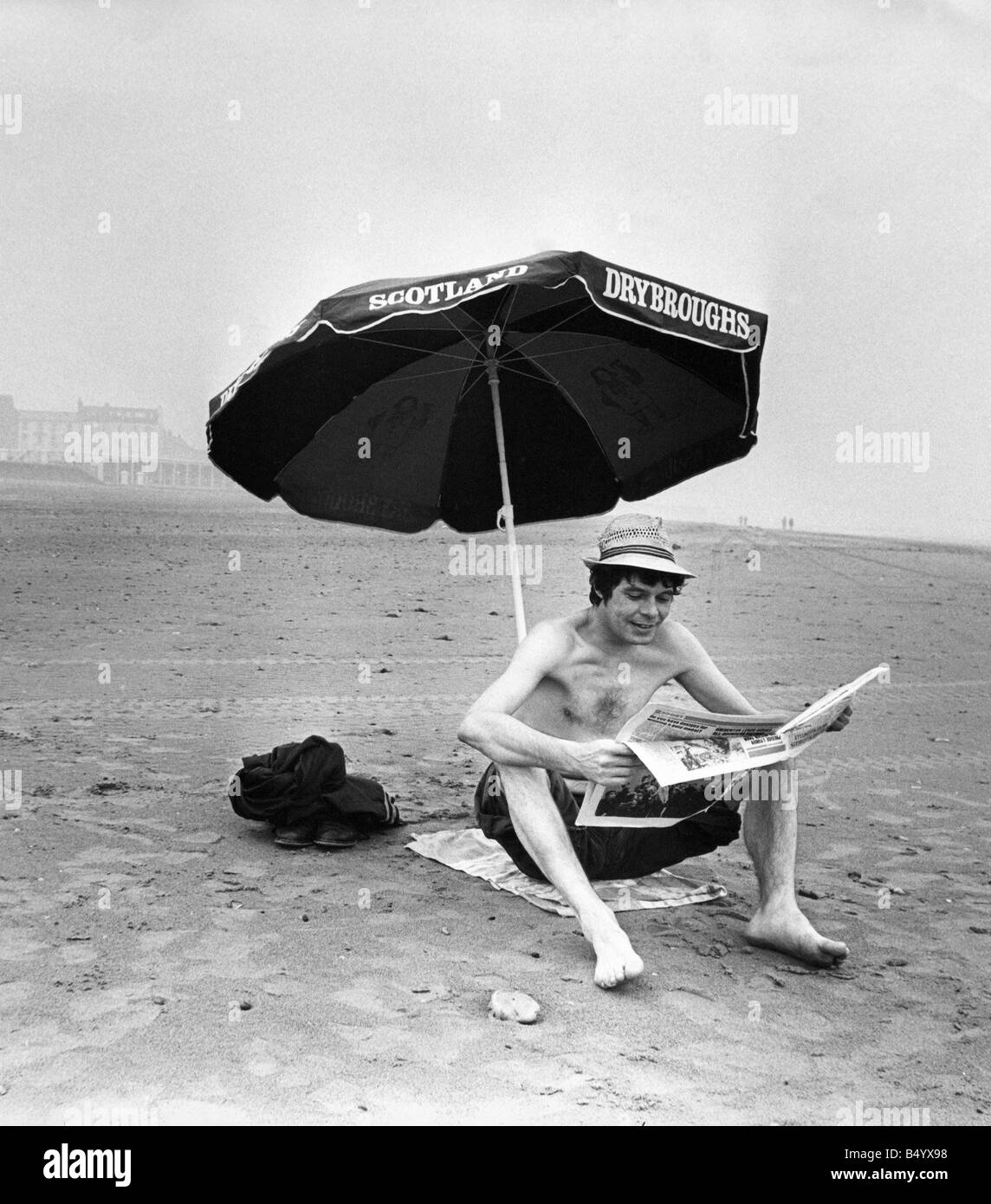 Frank Armitage lapping up the British Summer Weather on the beach at ...