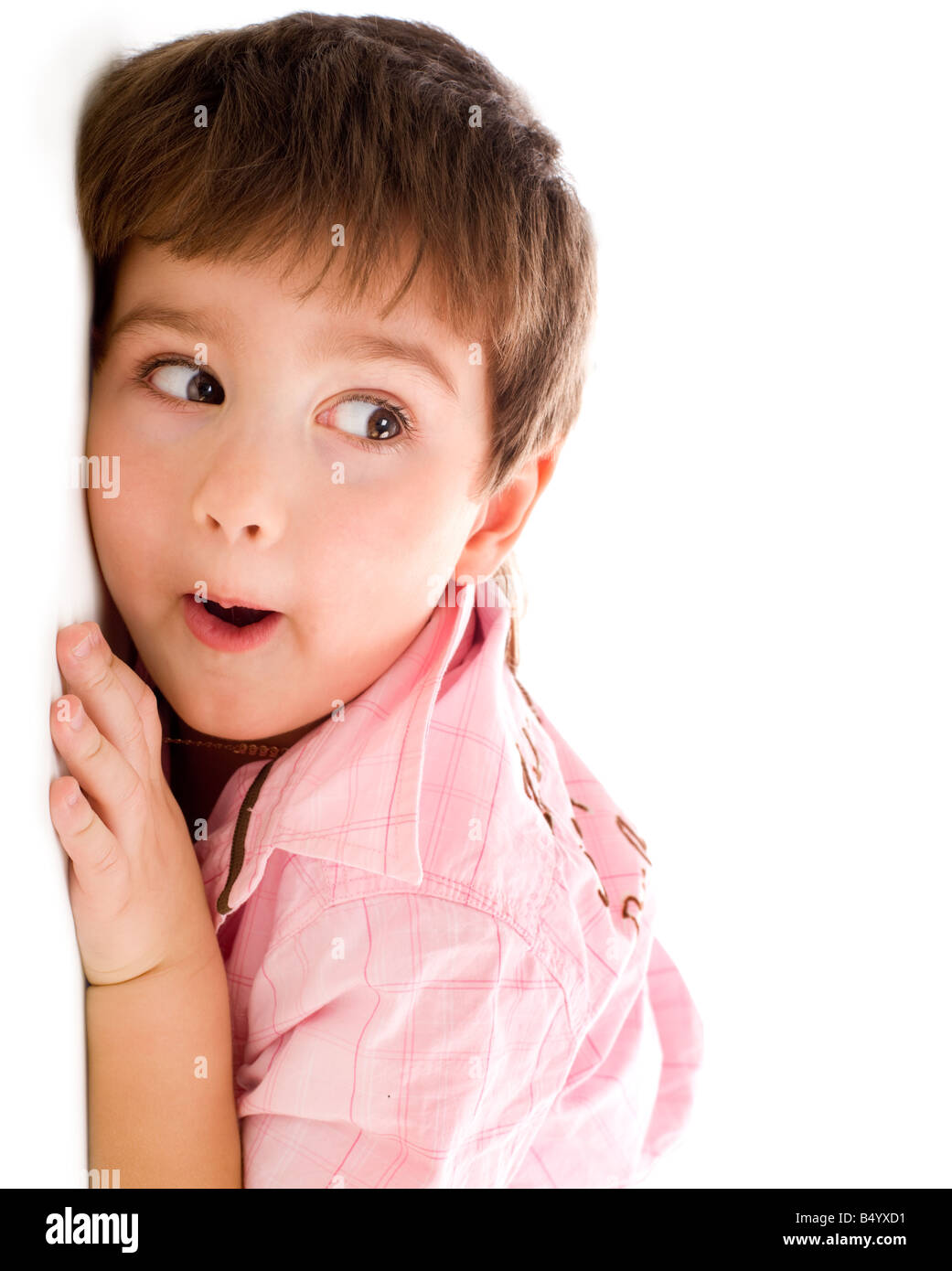 Listening young cute boy trying to guess gifts Stock Photo - Alamy