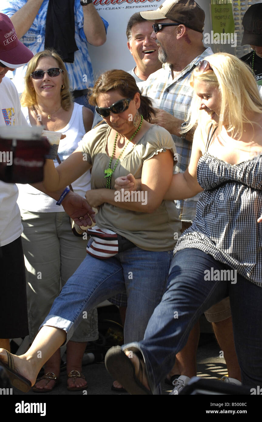 Women dance and men laugh at an outdoor street party in Southern ...