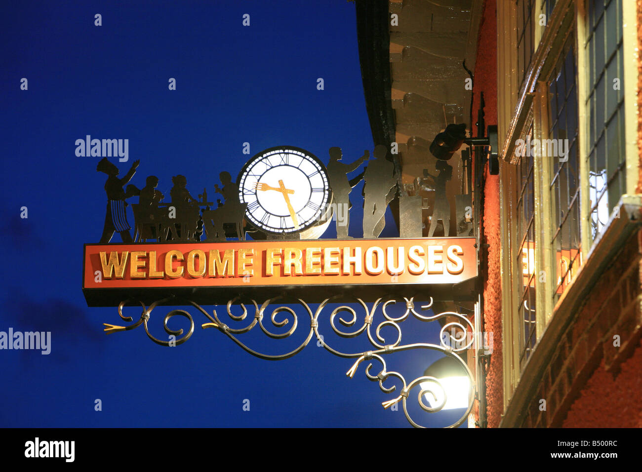 Pub sign with clock Stock Photo - Alamy