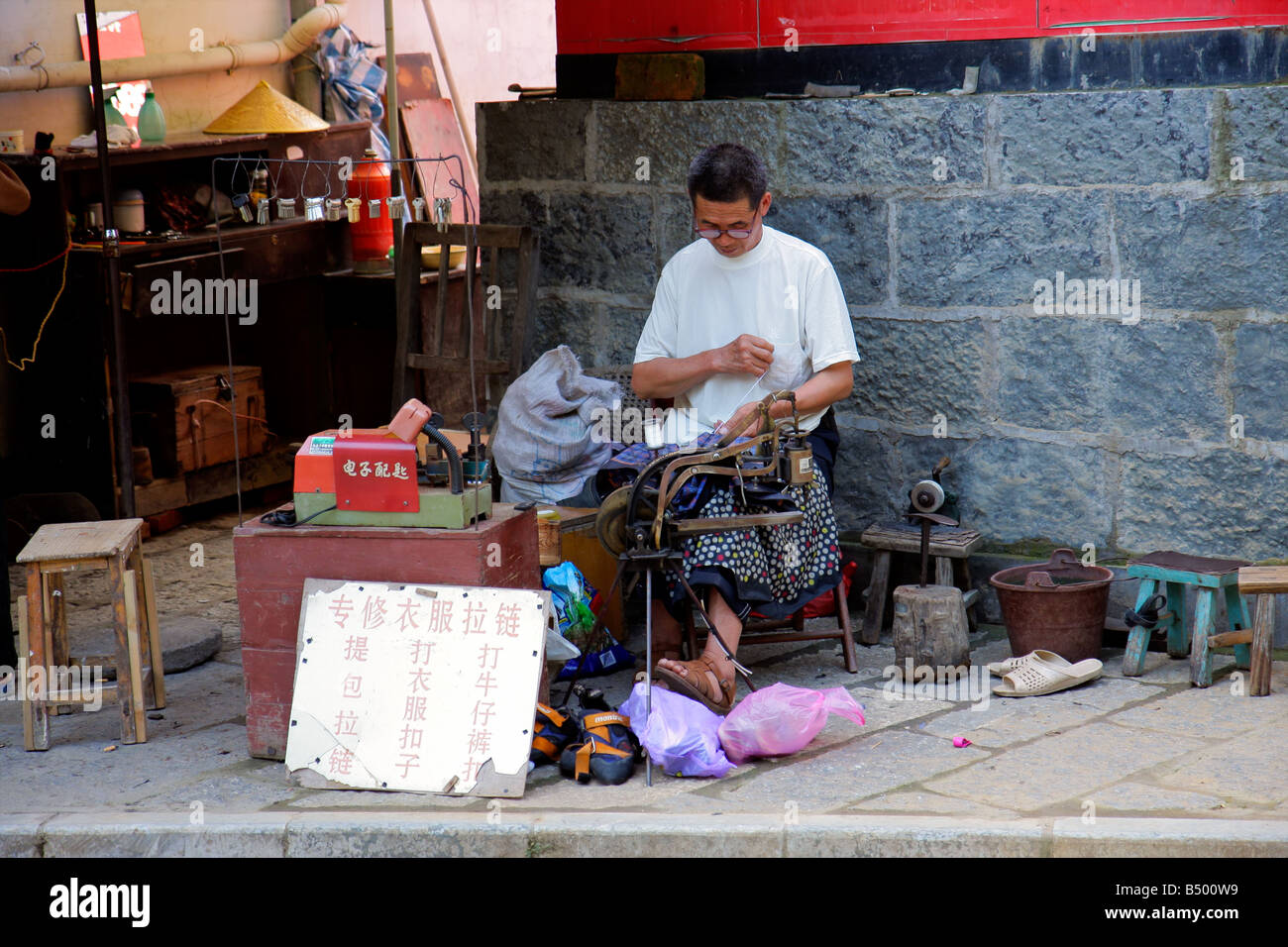 Mending clothes hi-res stock photography and images - Alamy