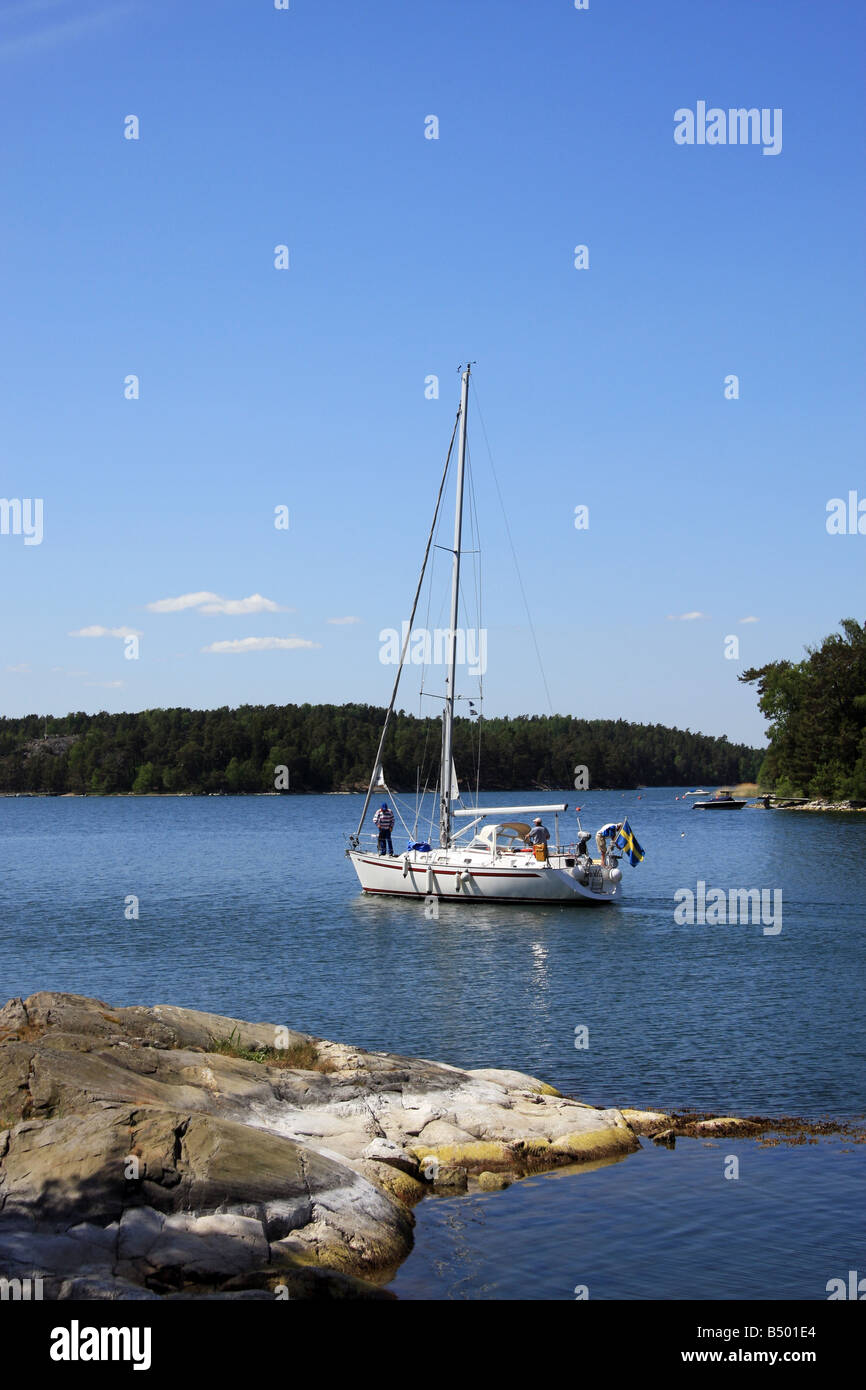 Yacht Leaving bay Stock Photo - Alamy