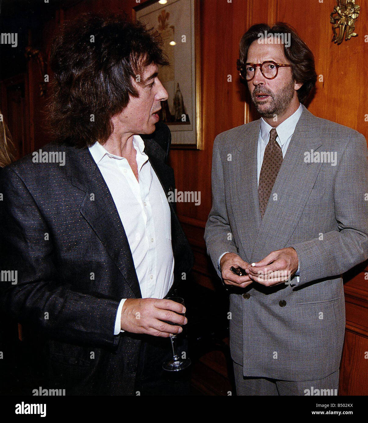 Eric Clapton at party chatting Stock Photo - Alamy