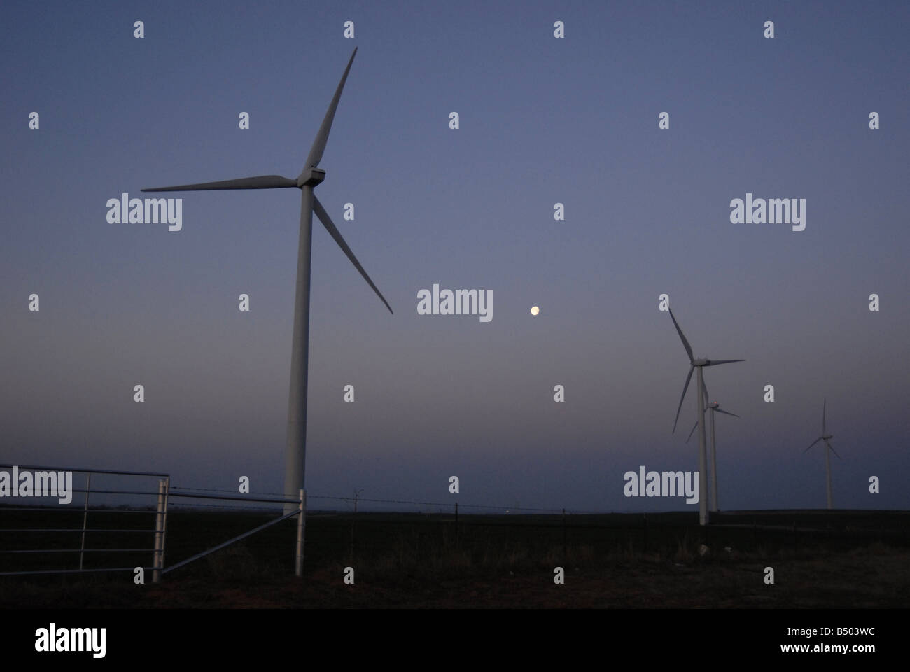 The moon over wind turbines at the Blue Canyon Wind Farm in Oklahoma ...