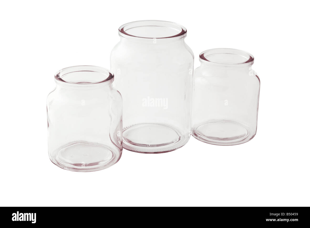 Empty glass jars on white background Stock Photo - Alamy